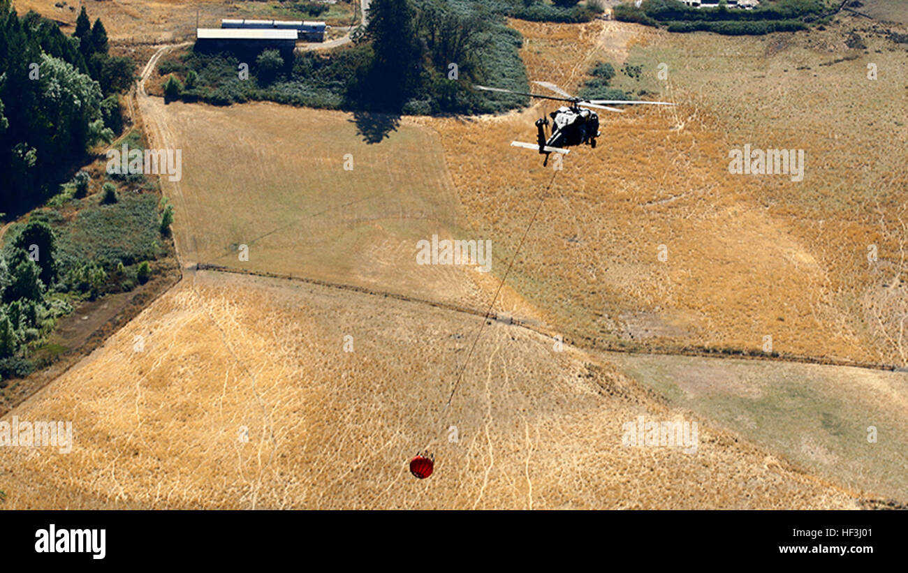 Firefighting helicopter delivering water hi-res stock photography and ...