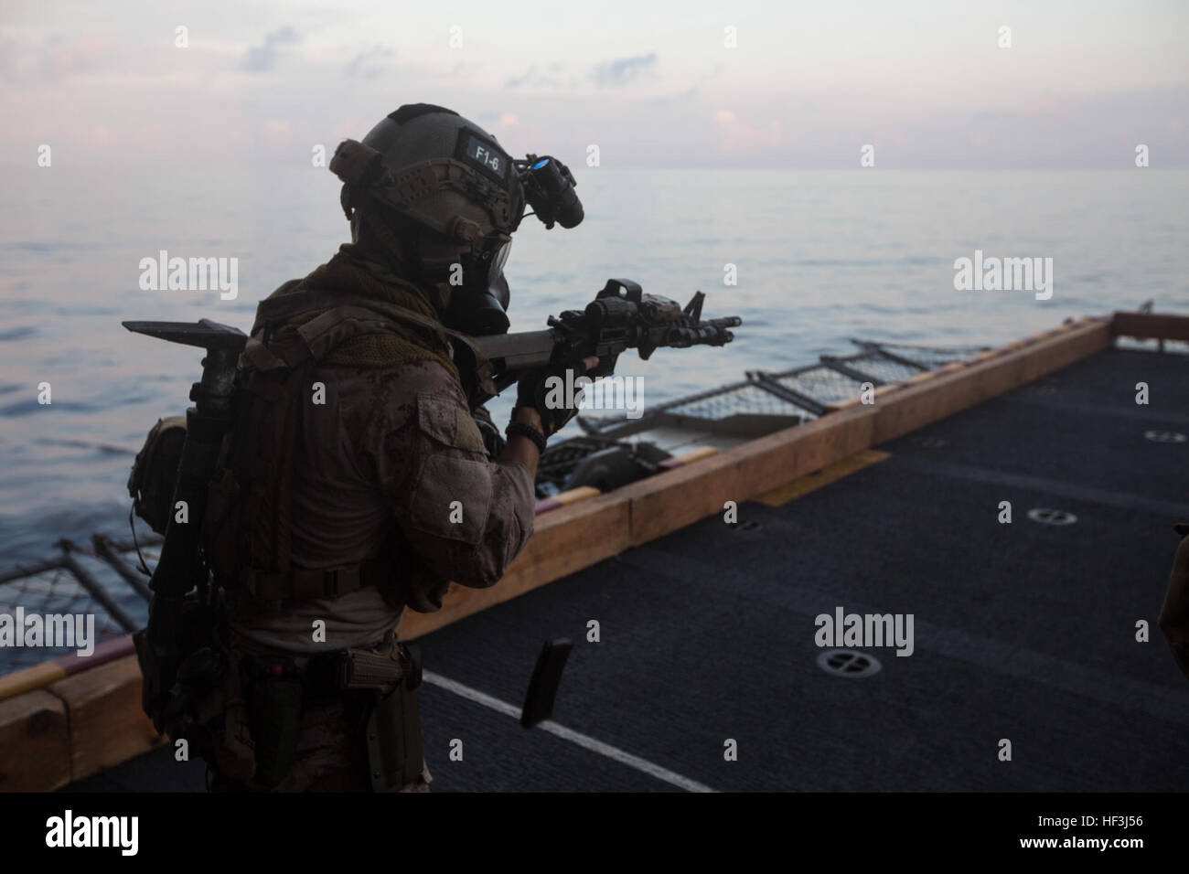 A reconnaissance Marine quickly reloads his M4 carbine during a close ...