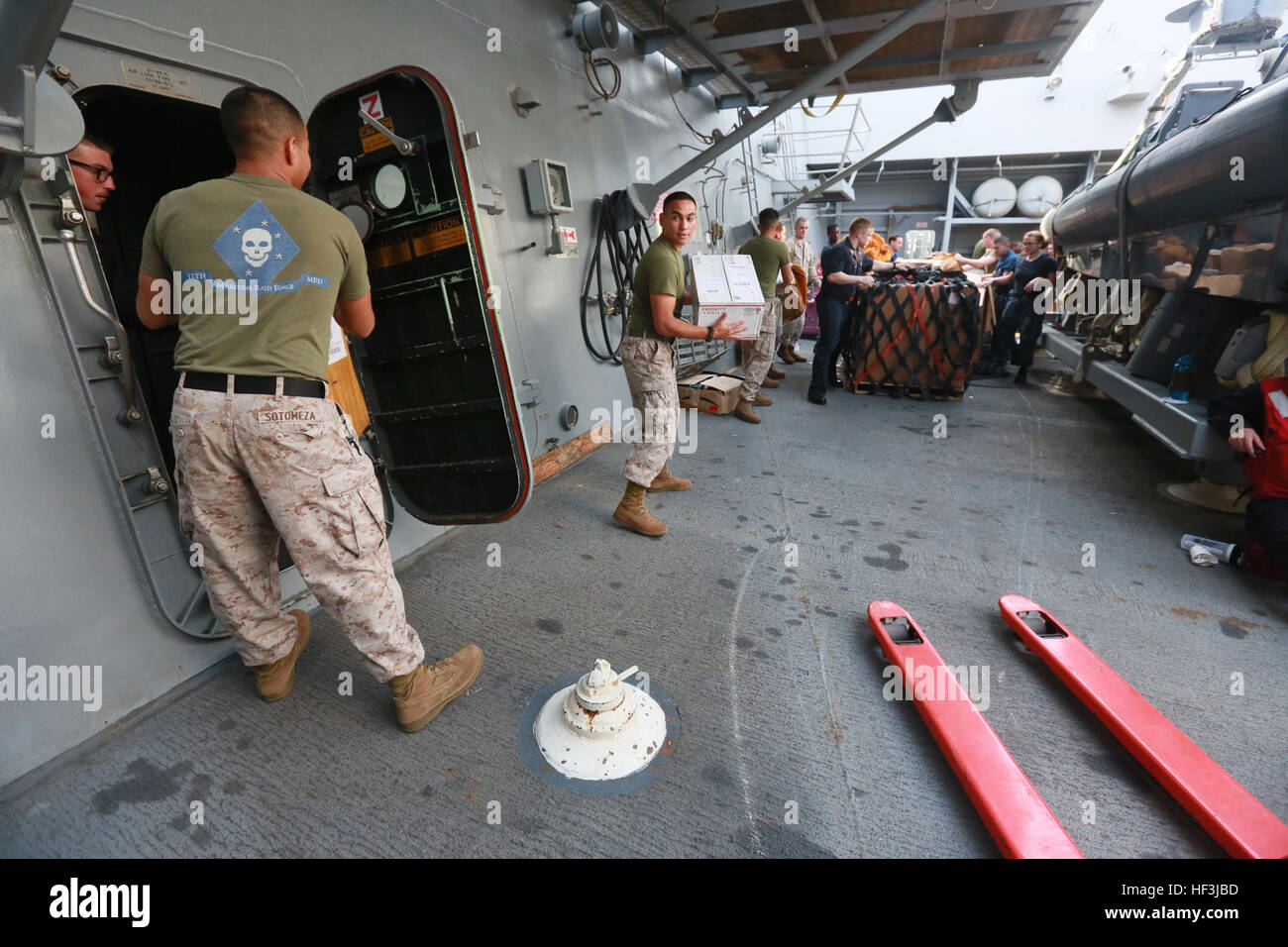 U.S. Marines and Sailors with the 15th MEU aboard USS Anchorage sort ...