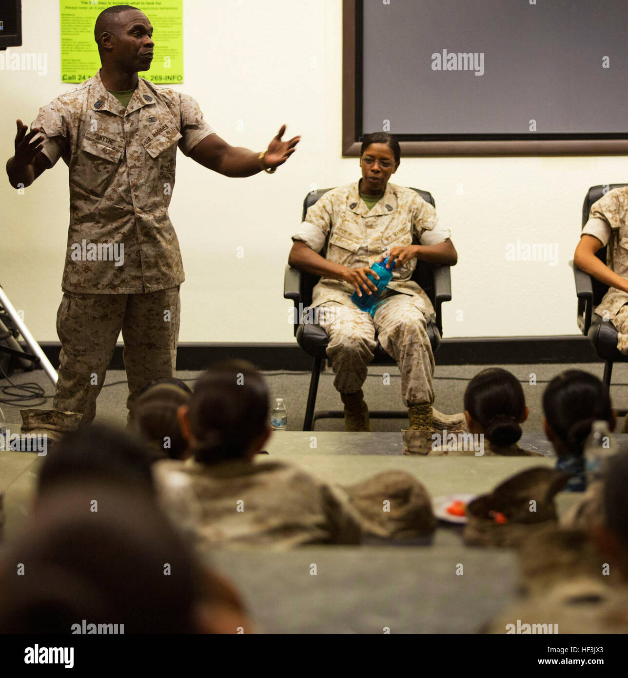 Sgt. Maj. Delvin Smythe introduces a panel of leaders at a women’s ...