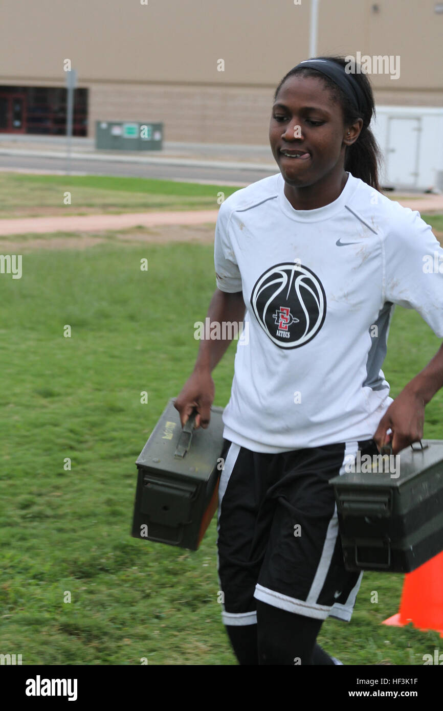 A San Diego State University women's basketball player carries two 30 ...
