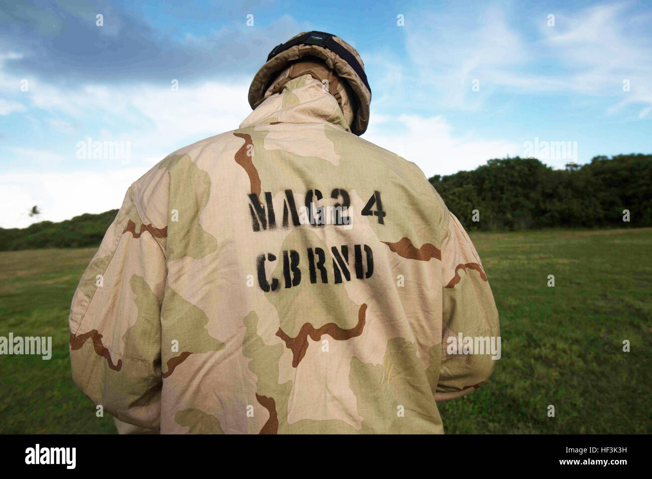 A CBRN Marine performs point surveillance at Boondocker Training Area ...