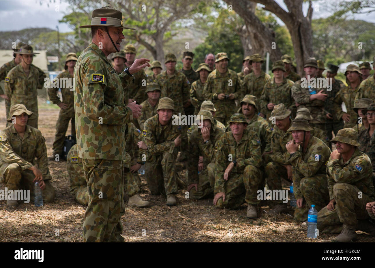 Australian Army Warrant Officer Don Spinks speaks with members of the ...