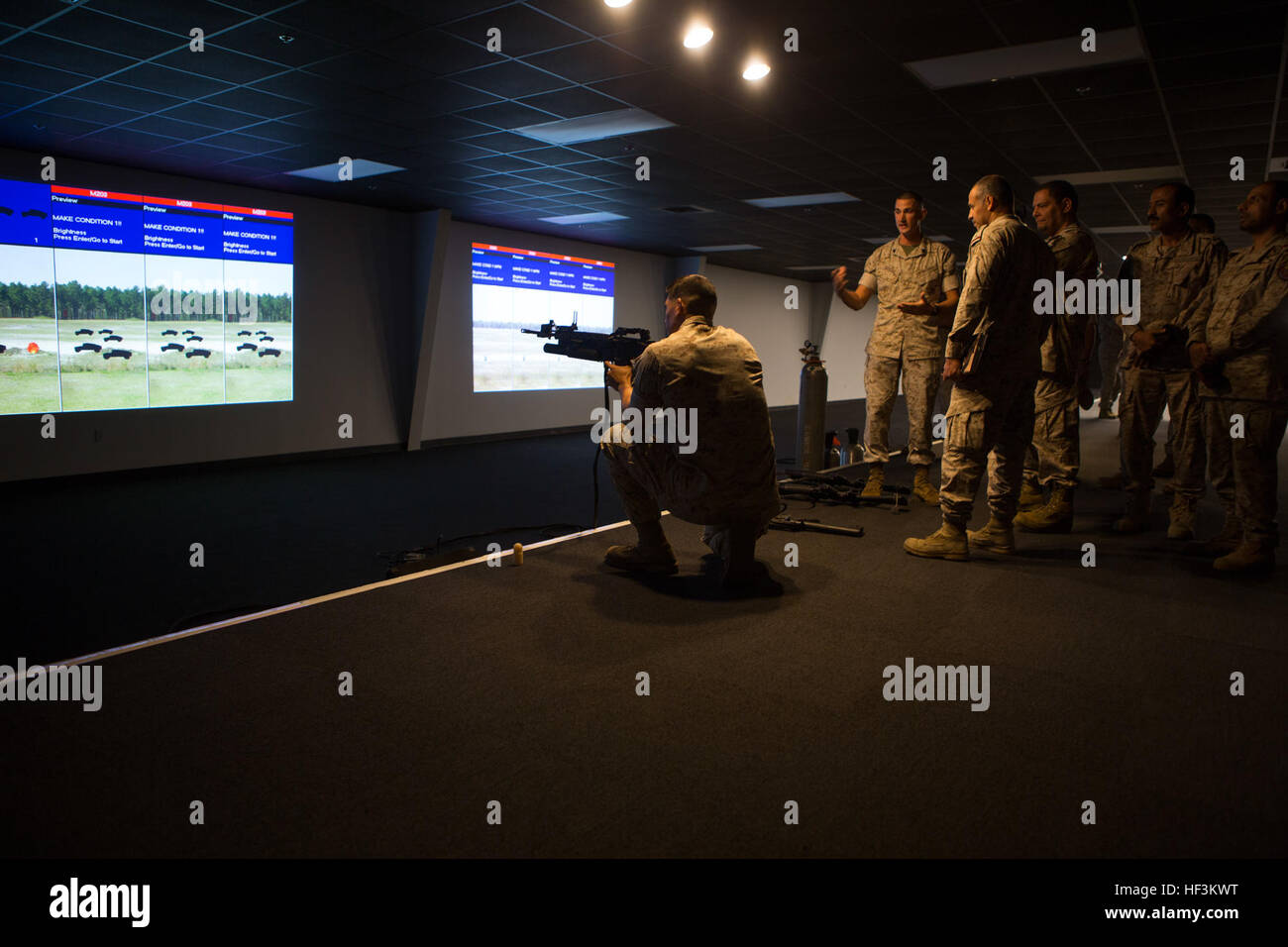 USMC Combat Instructor demonstrates M203 Grenade Launcher to Royal ...
