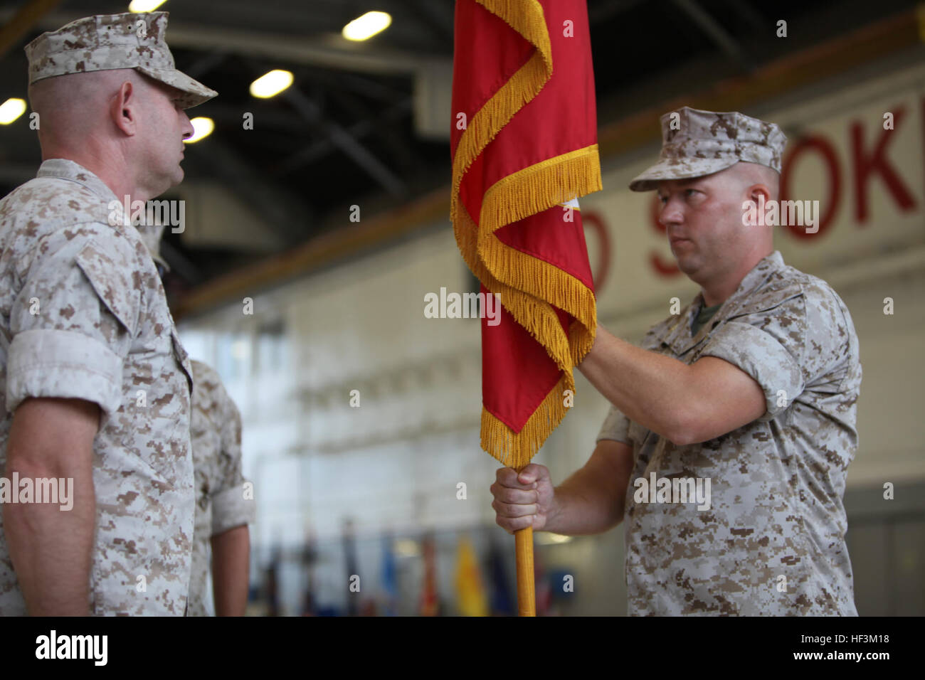 Lt. Col. Scott Koltick (right) passes the flag to Lt. Col. Claiborne ...