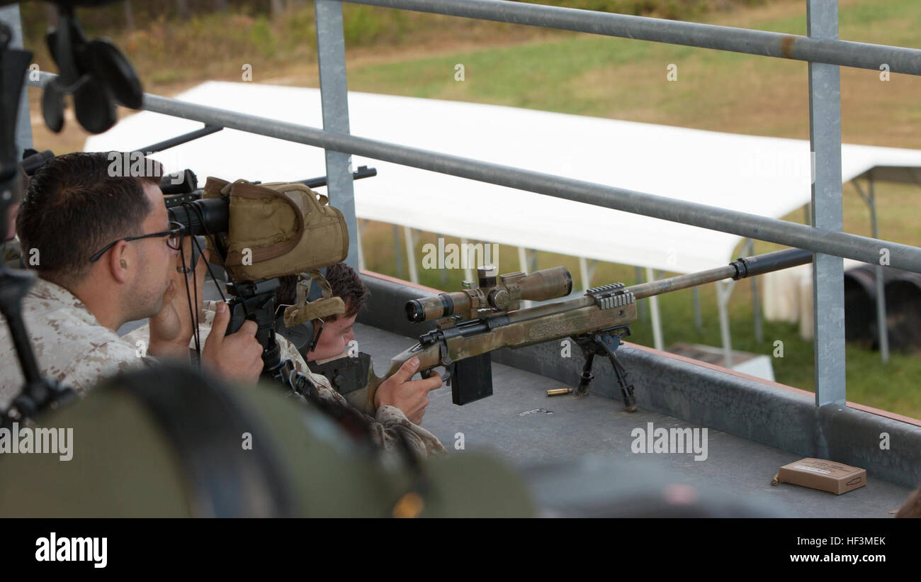 A Marine Corps sniper and his spotter attempt to shoot a robotic moving ...
