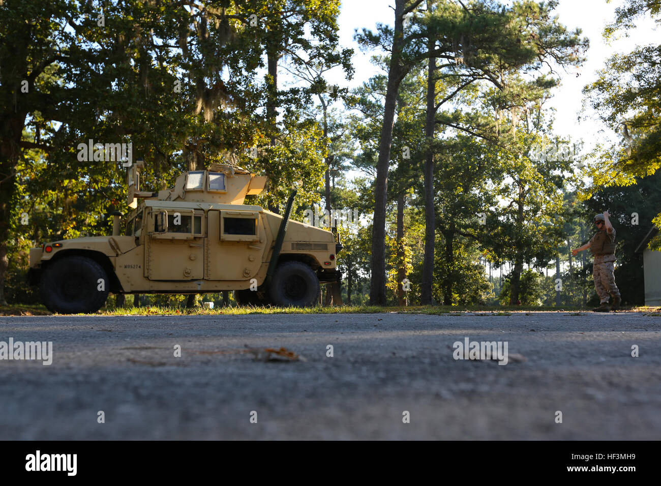 Cpl. Harry Garrett guides a Humvee during an Incidental Humvee ...