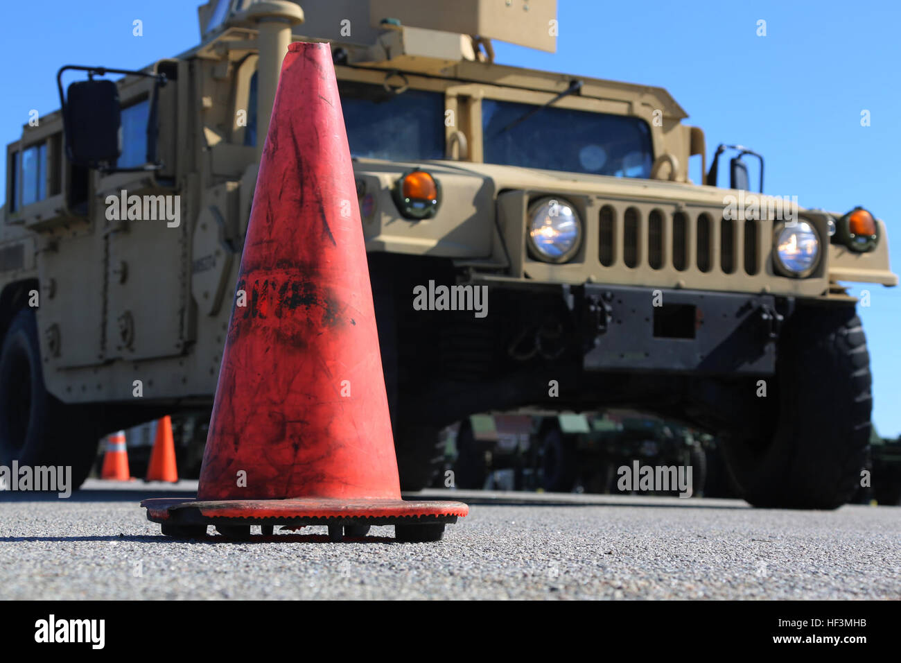 Marines maneuver a Humvee through a modified barrier during an ...
