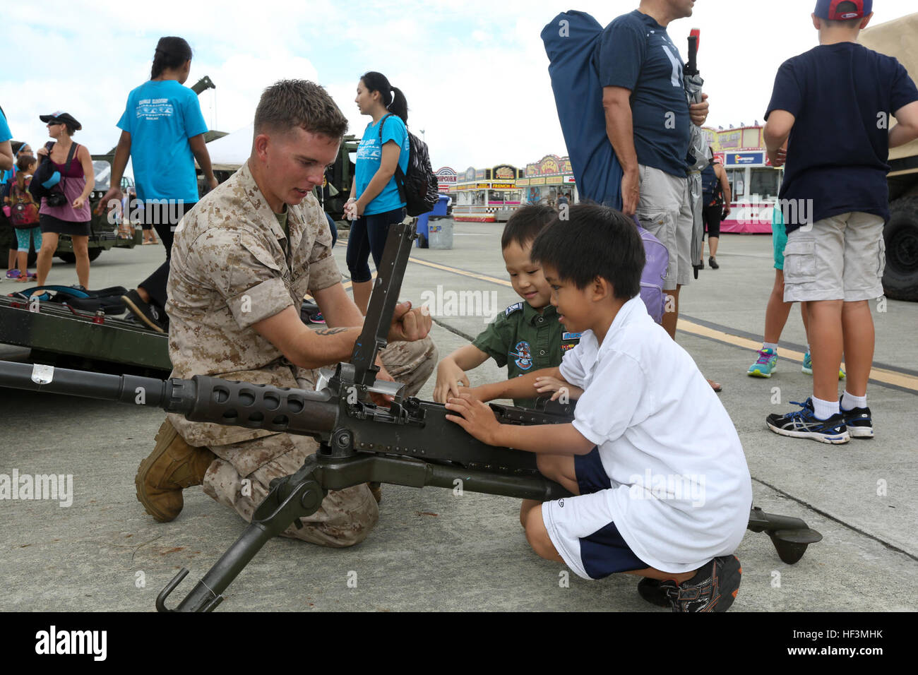 A U.S. Marine demonstrates how to clear an M2 .50 caliber machine gun ...