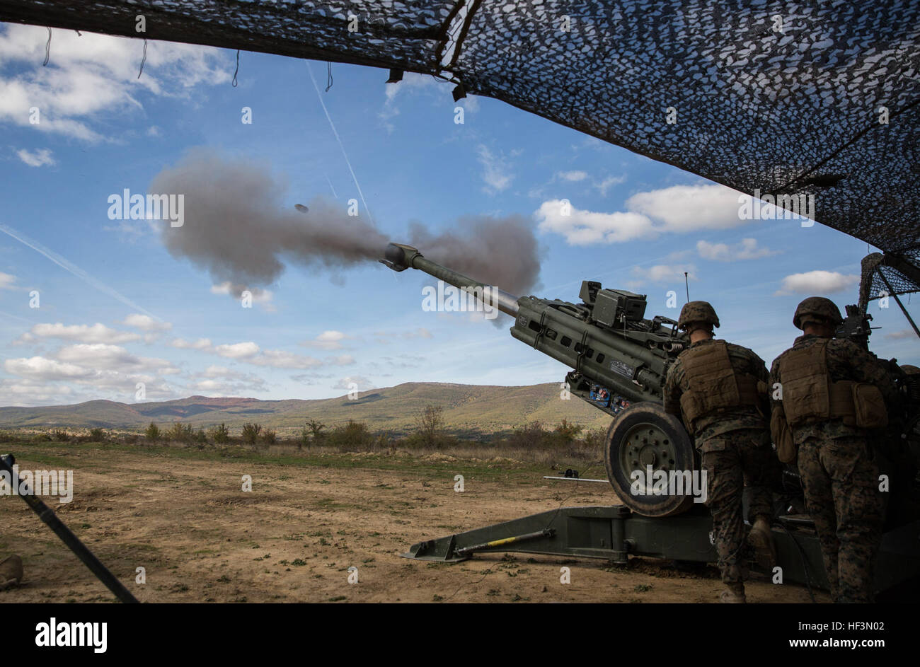 Marines with the Combined Arms Company demonstrate the M-777 Howitzer ...
