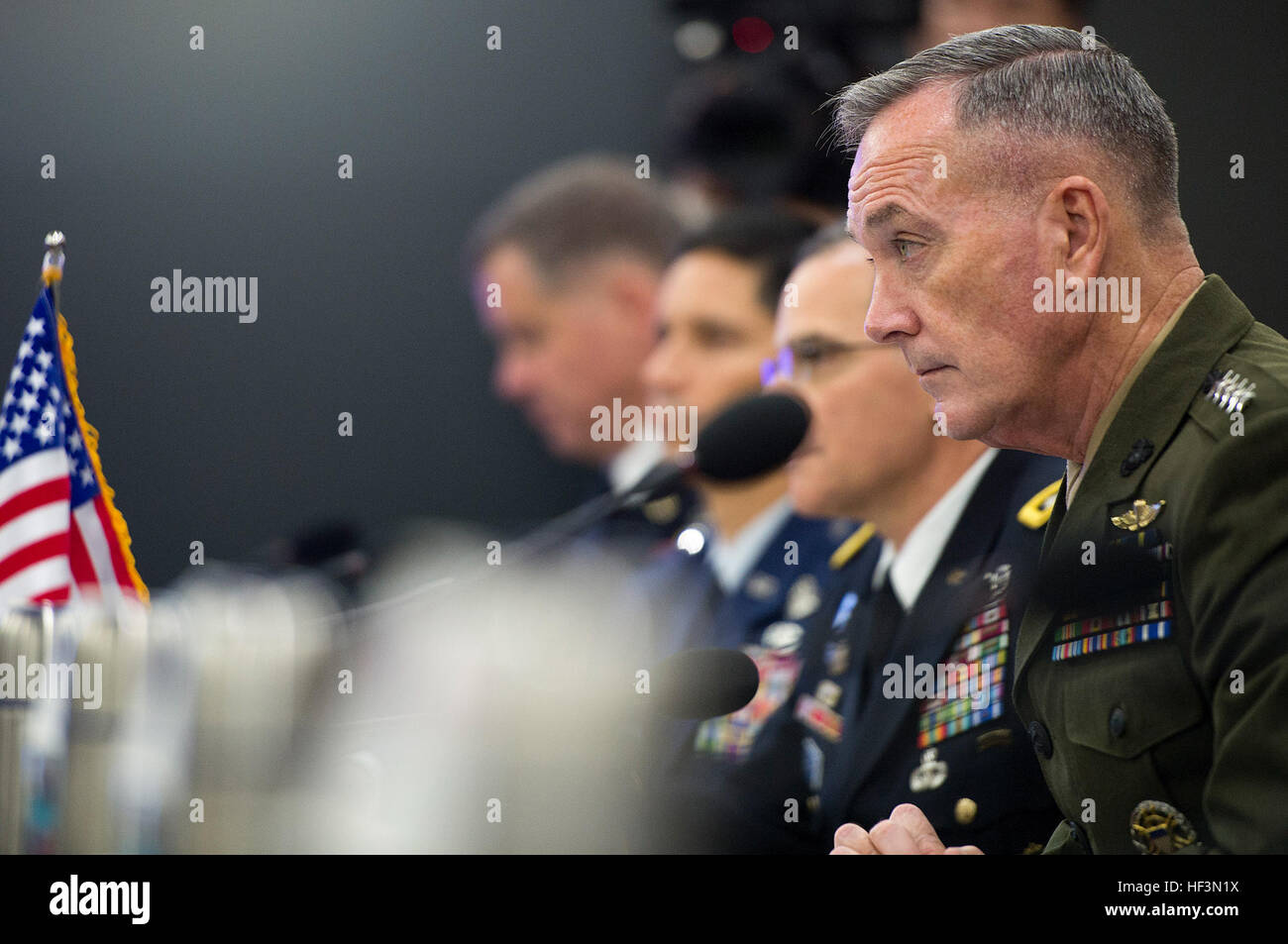 Marine Corps Gen. Joseph F. Dunford Jr., 19th Chairman of the Joint Chiefs of Staff, listens to ...