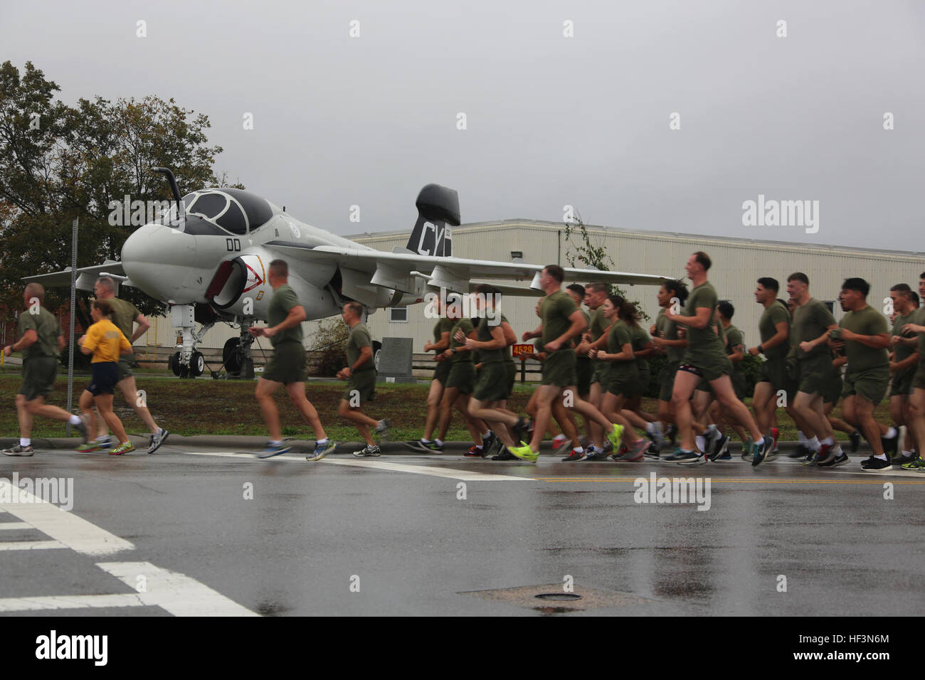 Hundreds of Marines run under cloudy skies during the Marine Corps ...