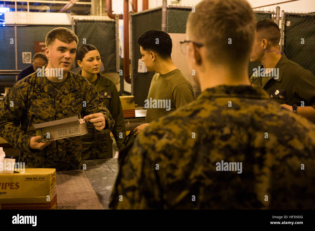 U.S. Marine Corps Sgt. Cameron C. Gump, left, instructs Lance Cpl ...