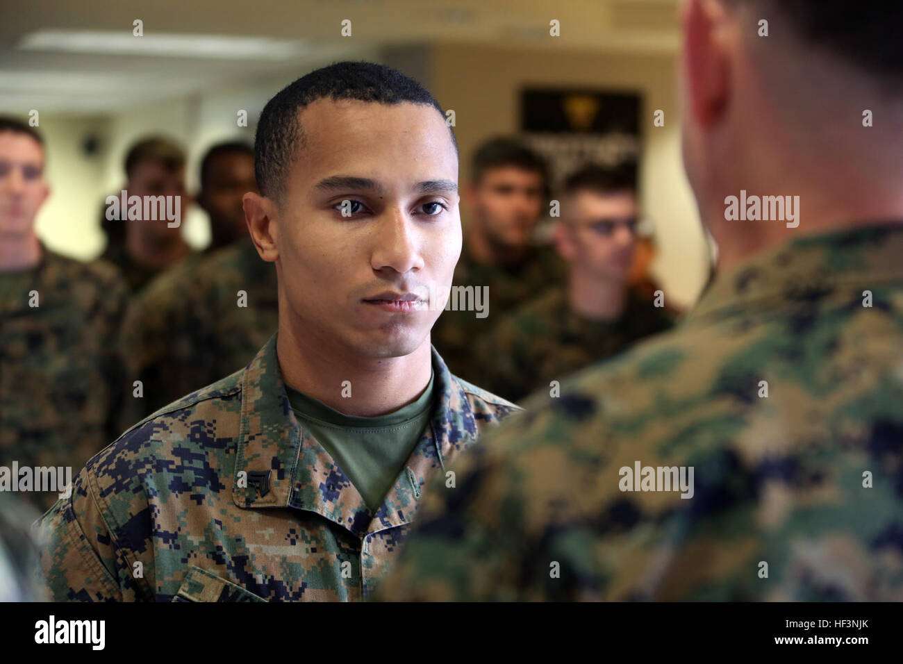 Cpl. Justin McDaniel accepts the Navy and Marine Corps Achievement ...