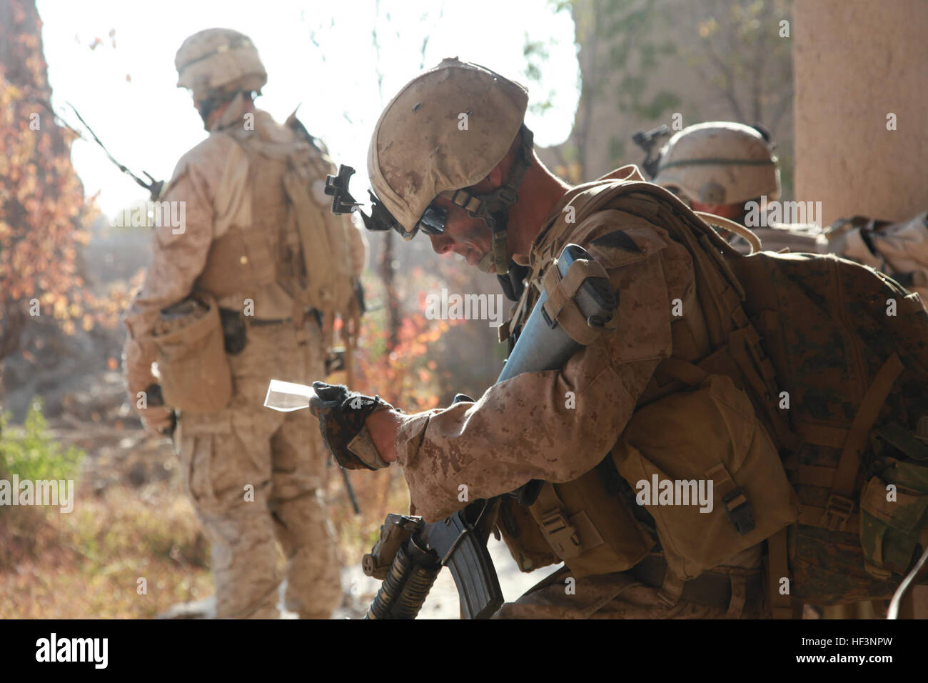 U.S. Marines with Lima Company, 3rd Battalion, 4th Marine Regiment stop ...