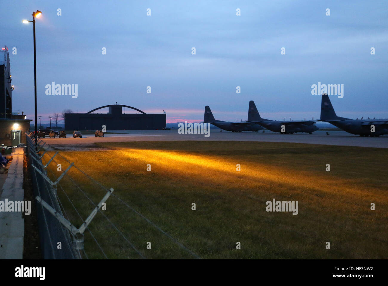 C-130H Hercules sit on the ramp just before dusk at the 179th Airlift ...
