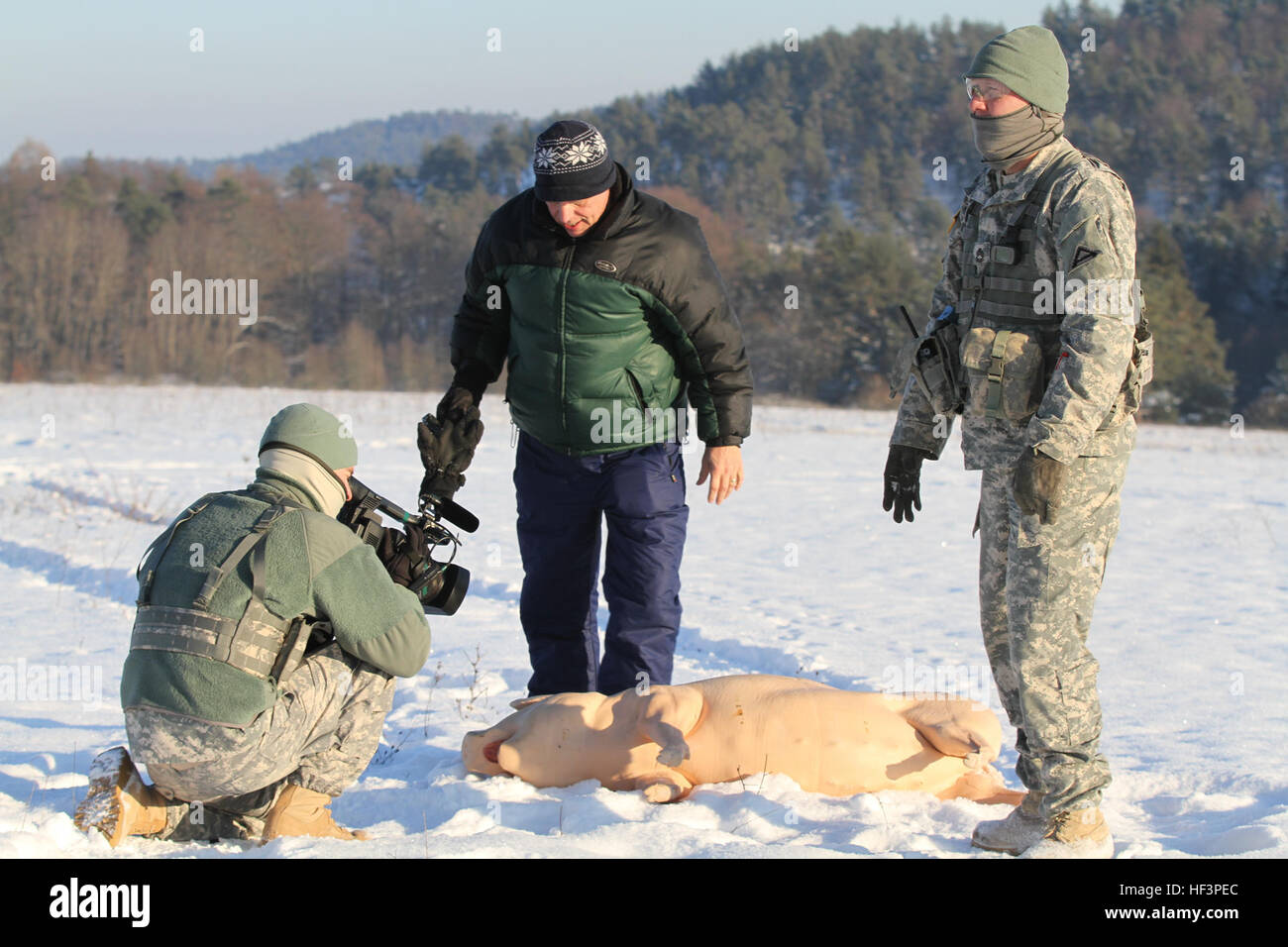 Sgt. Jason Beal gets up close and personal with a robotic pig used for ...