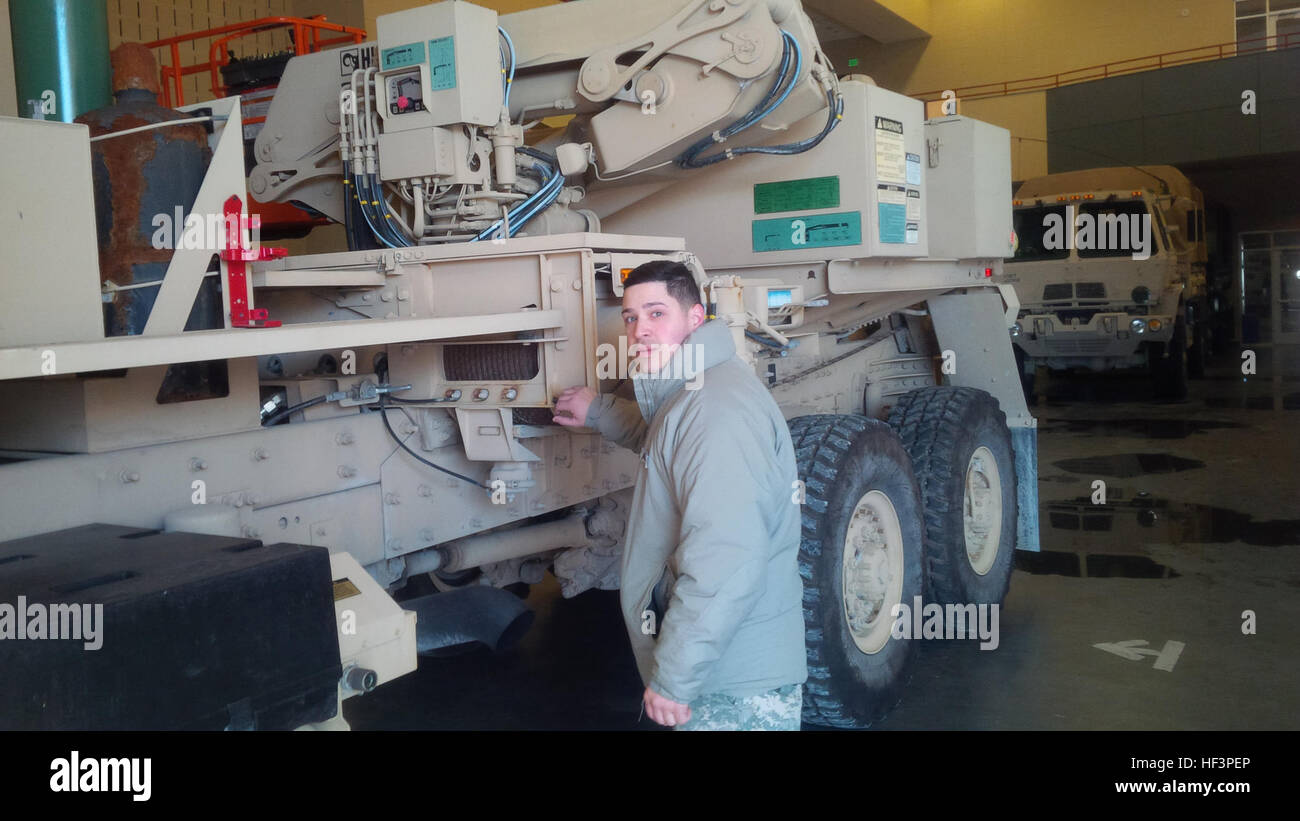 New York Army National Guard personnel stand by with vehicles at ...