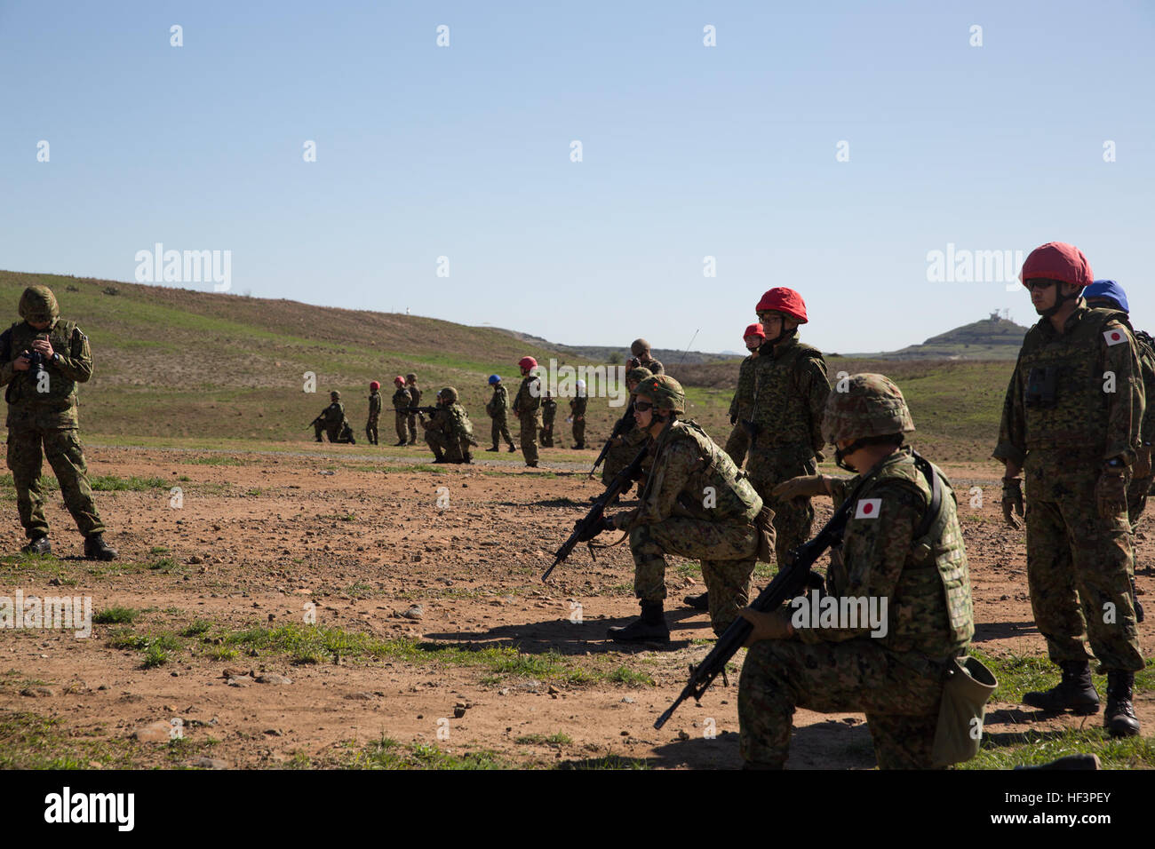 Japan Ground Self-Defense Force soldiers establish a base of fire while ...