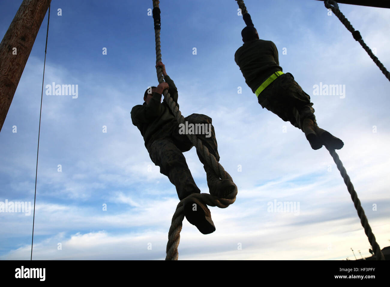 Marines with Headquarters Battalion, 1st Marine Division climb ropes ...