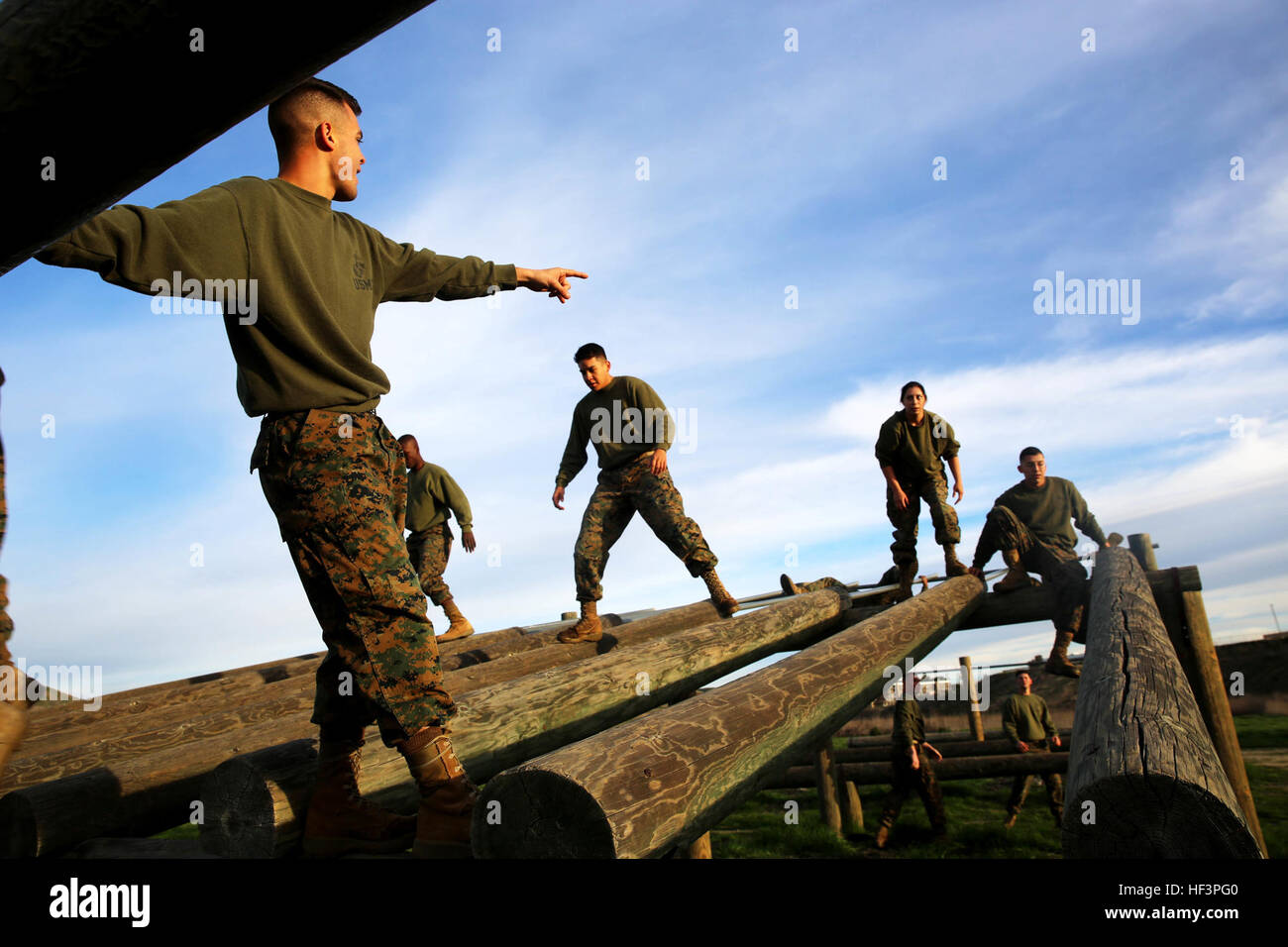 Students work together to navigate the obstacle course during a ...