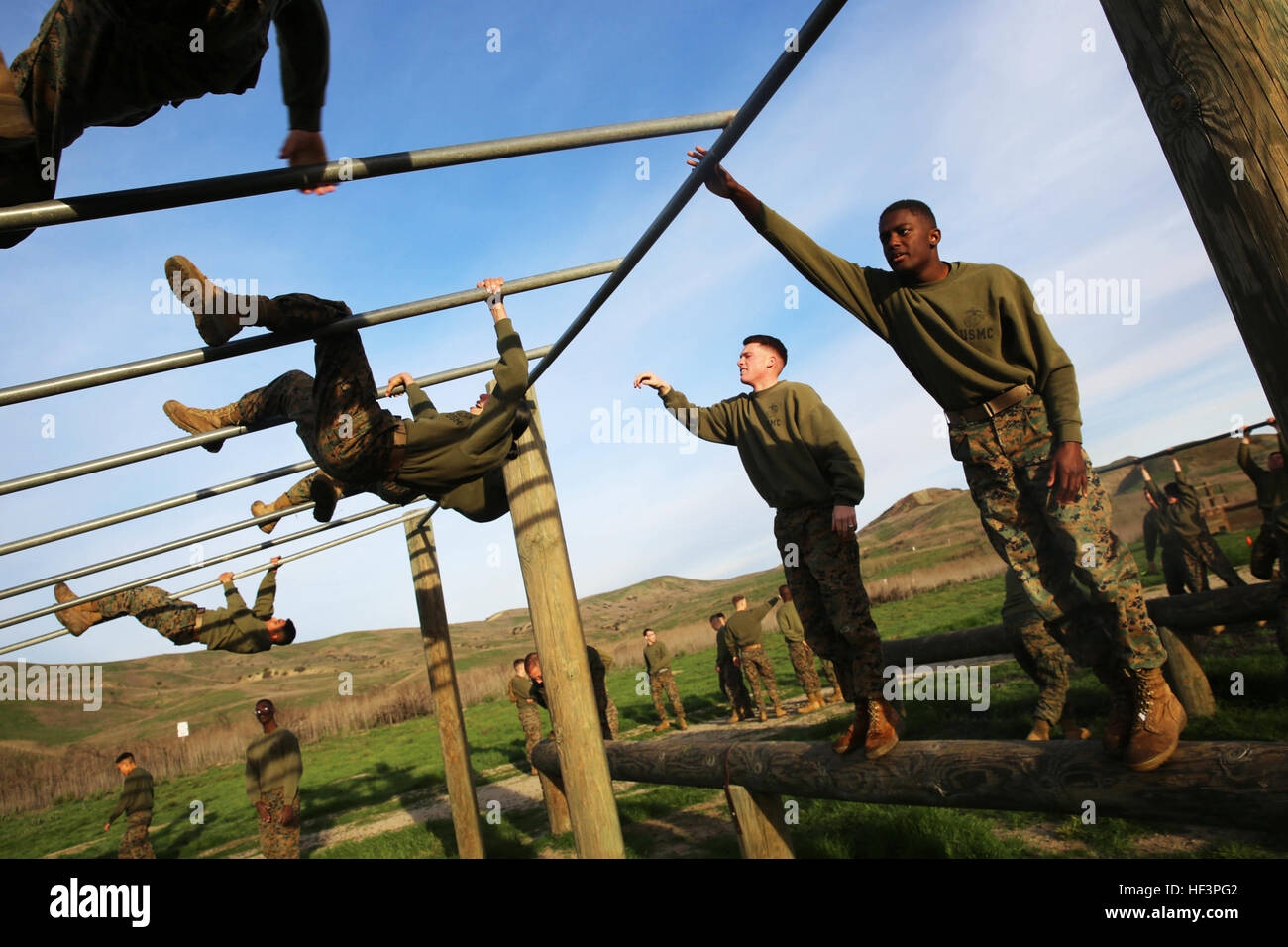 Marines race through the obstacle course during a Headquarters ...