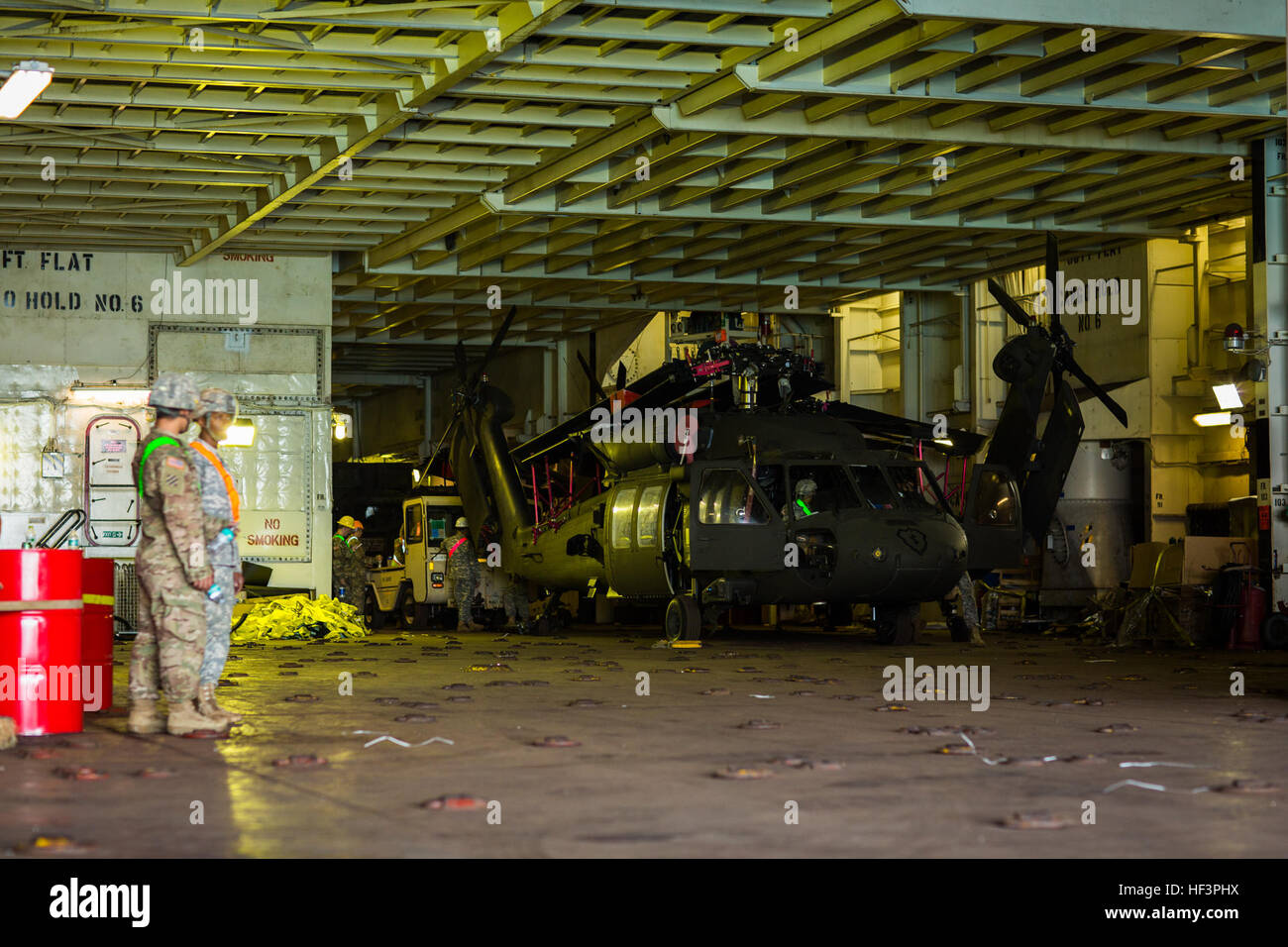 U.S. Army Soldiers with 835th Transportation Battalion, unload a UH-60 ...