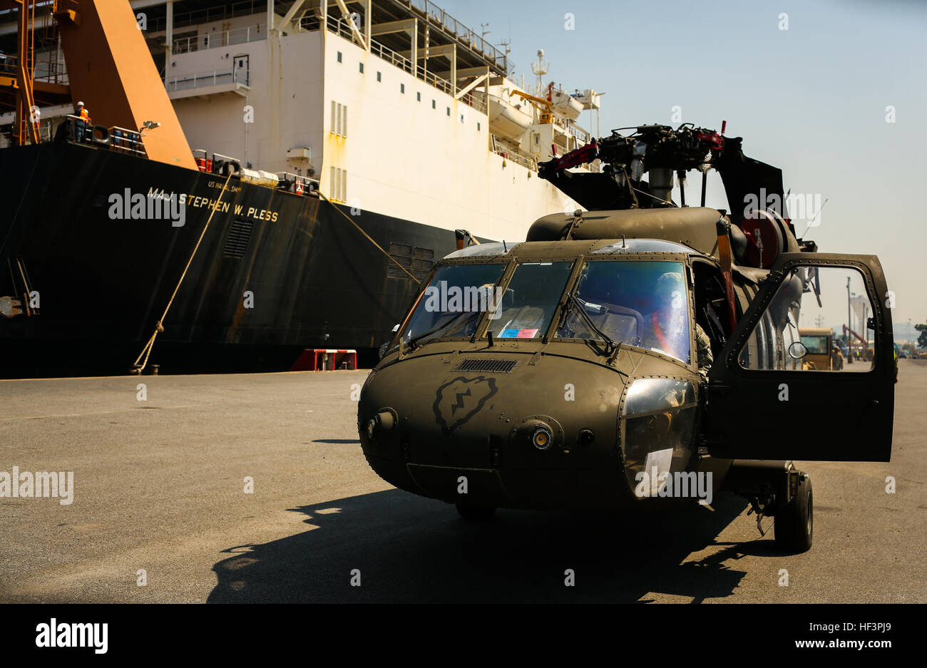 A UH-60 Black Hawk Helicopter is staged after being offloaded from the ...