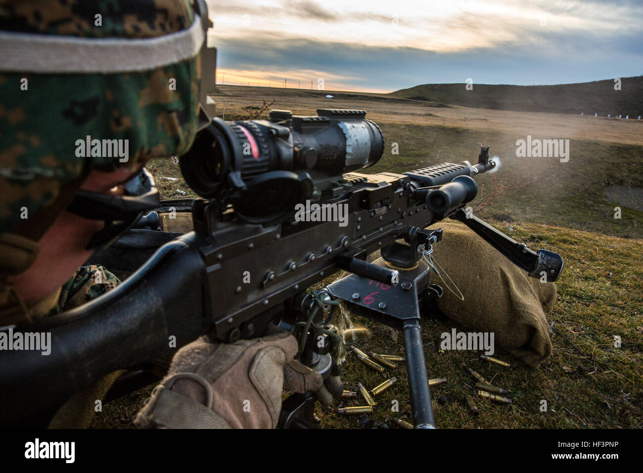A U.S. Marine with Black Sea Rotational Force fires an M240B light ...