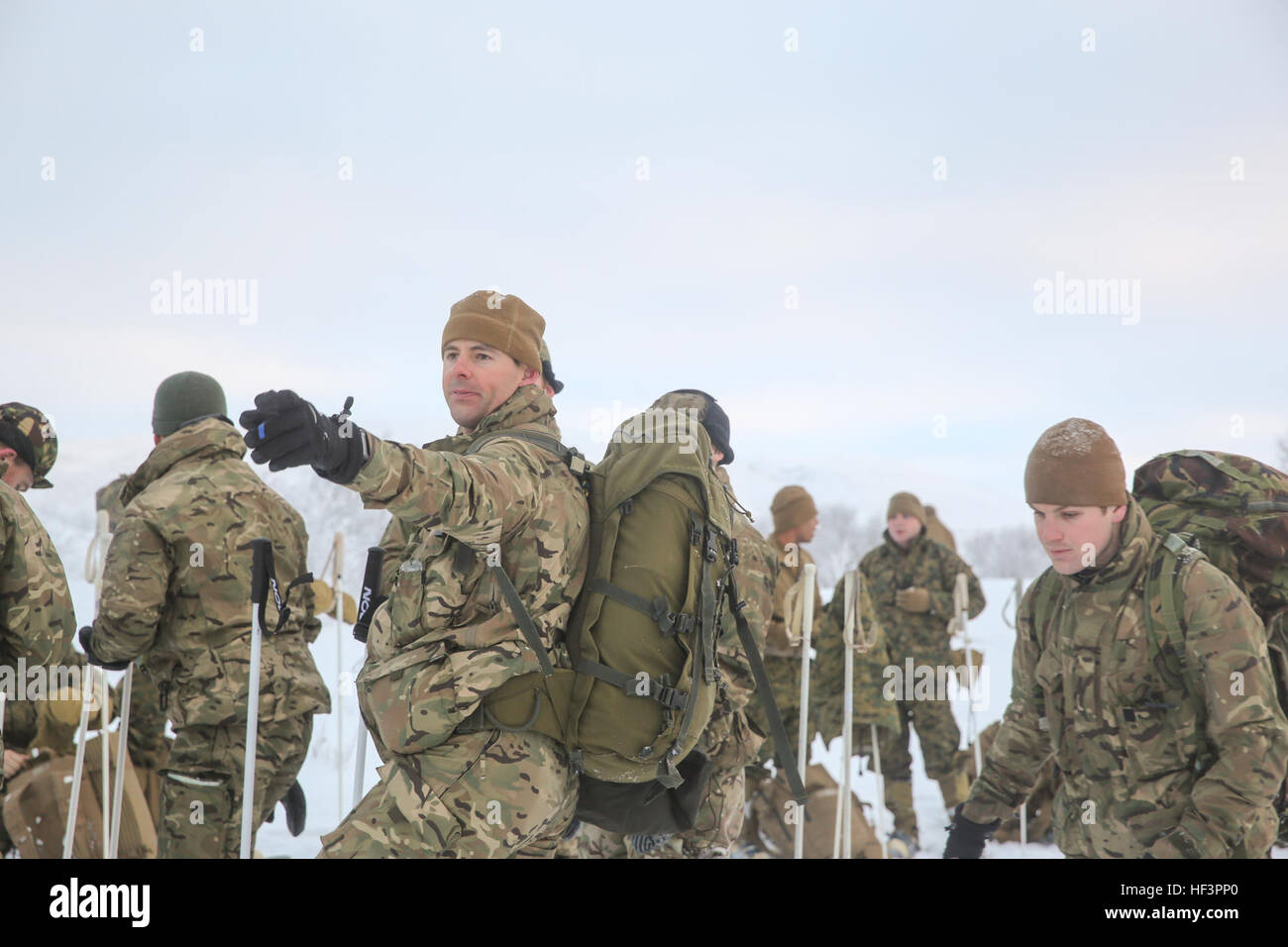 A U.K. Royal Commando mountain leader explains to Marines with Black ...