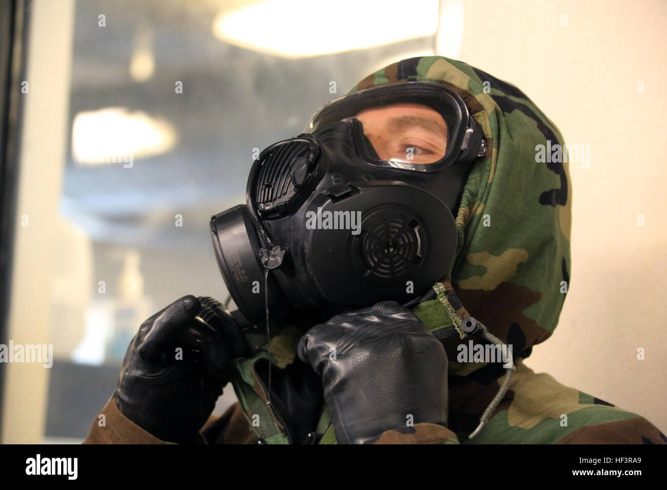 A Marine adjusts his M50 Joint Service General Purpose Mask during gas ...