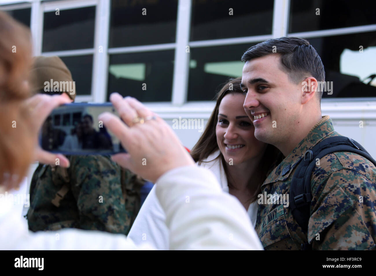 Petty officer 3rd class John Price poses with his wife Sarah during a ...