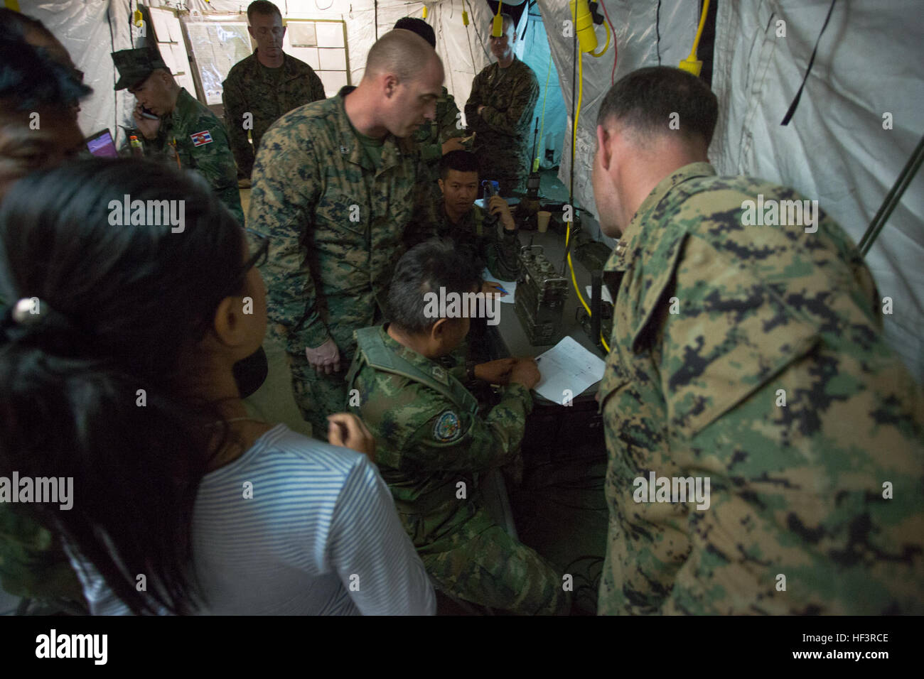 U.S. Marine Corps Capt. Jared Stokes, center, fire support officer ...