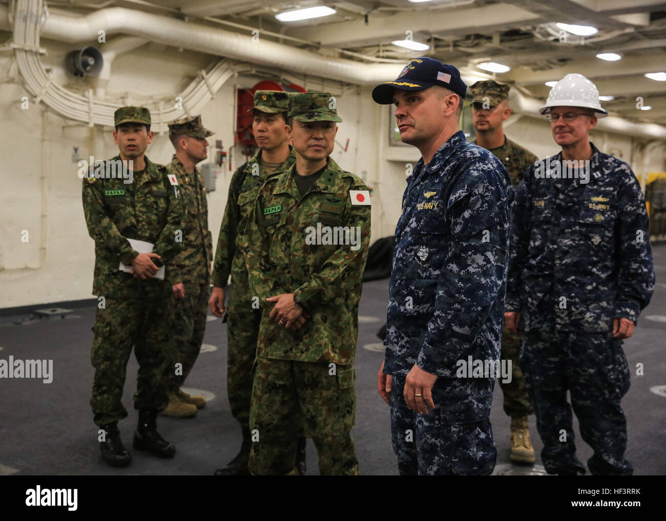 U.S. Navy Capt. Leonard E. Reed, commanding officer of the of the USS ...