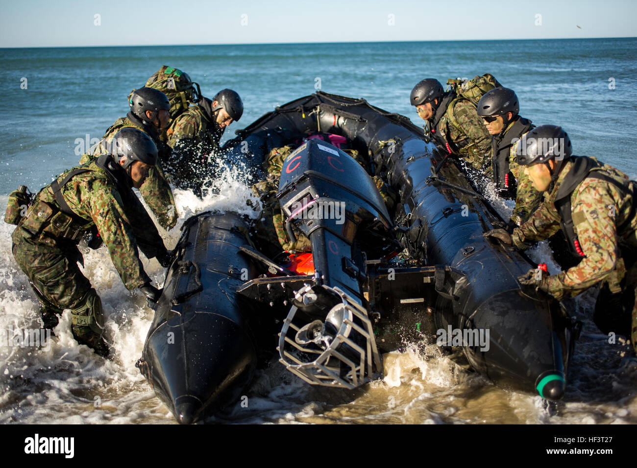 Japanese soldiers with the Japan Ground Self-Defense Force push the ...