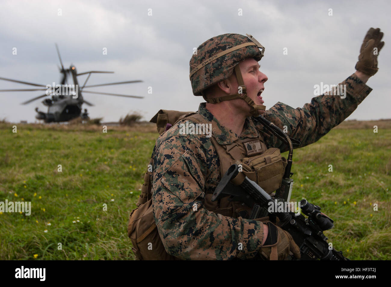Sgt. Russel Marchand shouts orders to his Marines as they set up a ...