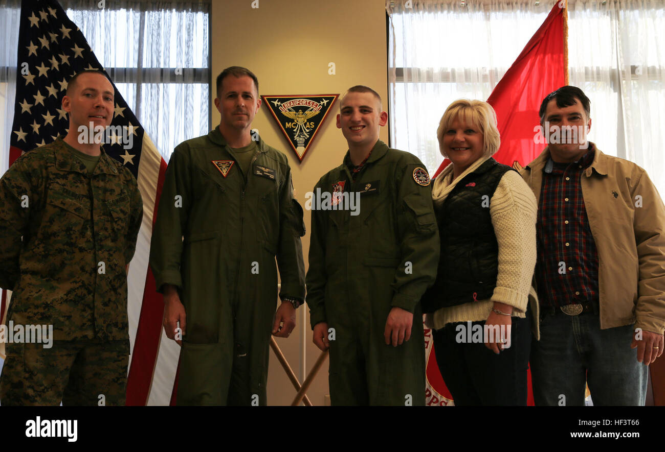 Timothy Rhodes, (center) poses with the Lt. Colonel Sean Henrickson and ...