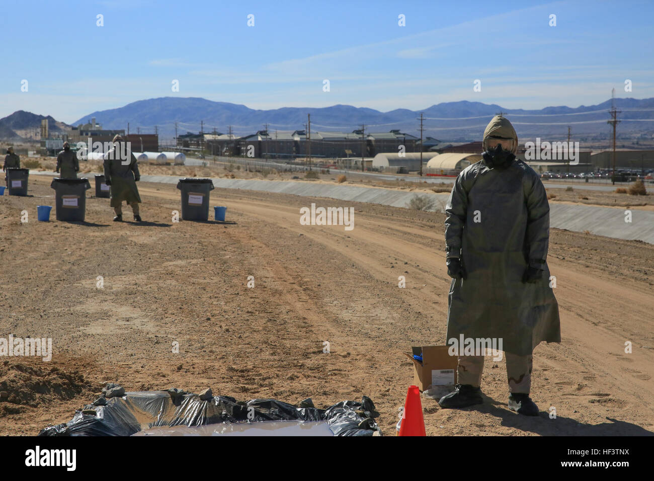 1st Tank Battalion Marines await to assist in decontaminating personnel ...