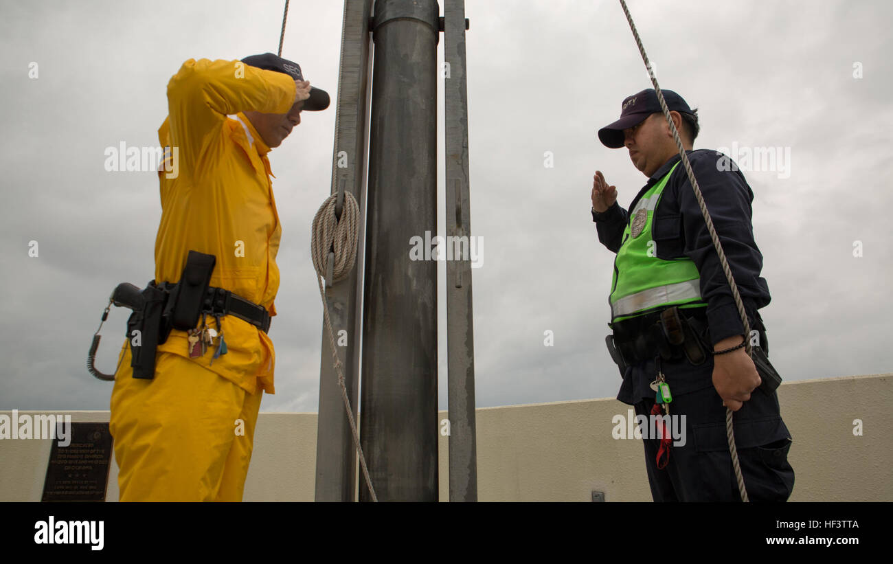 Japanese security guards salute as Kimi Ga Yo, the Japanese national ...
