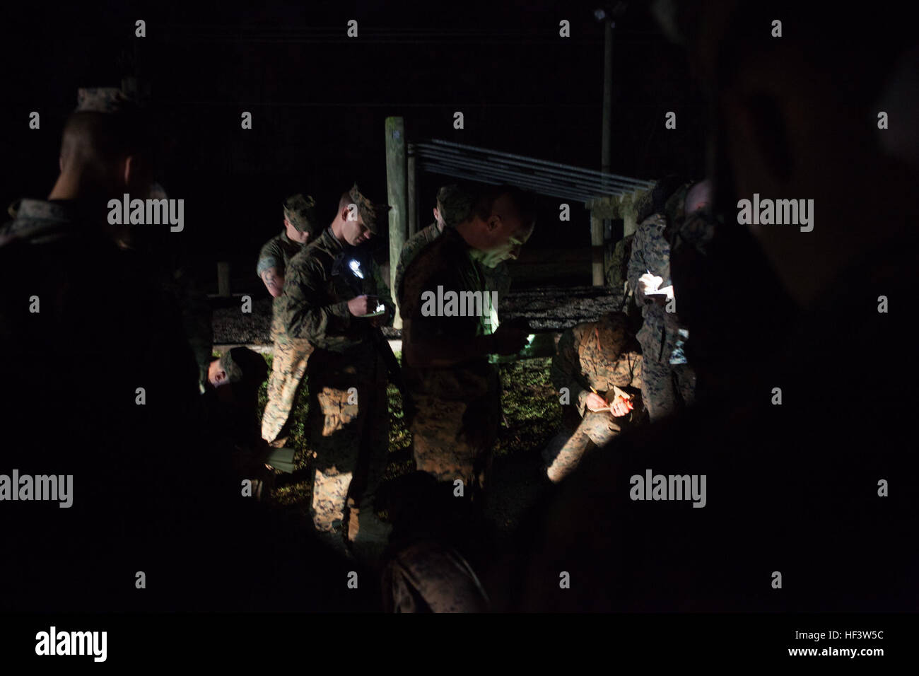 U.S. Marines and Navy Sailors consulted maps before conducting a ...