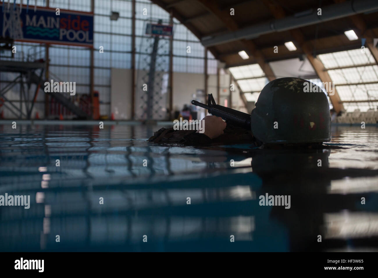A U.S. Marine assigned to Marine Air Control Group 28, swims with ...