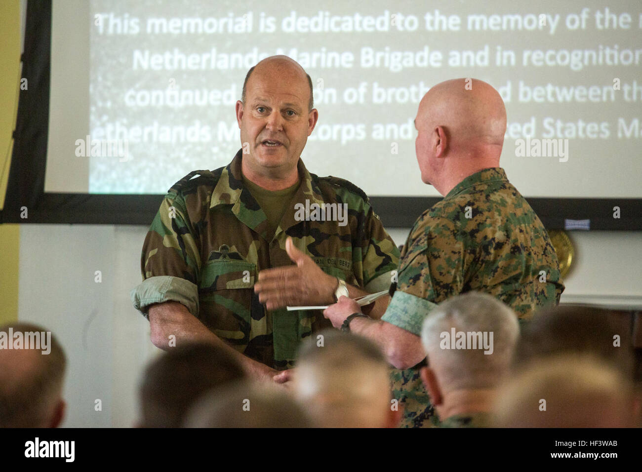 Col. Carlo Van Den Berg, left, a Royal Netherlands Marine, presents U.S ...