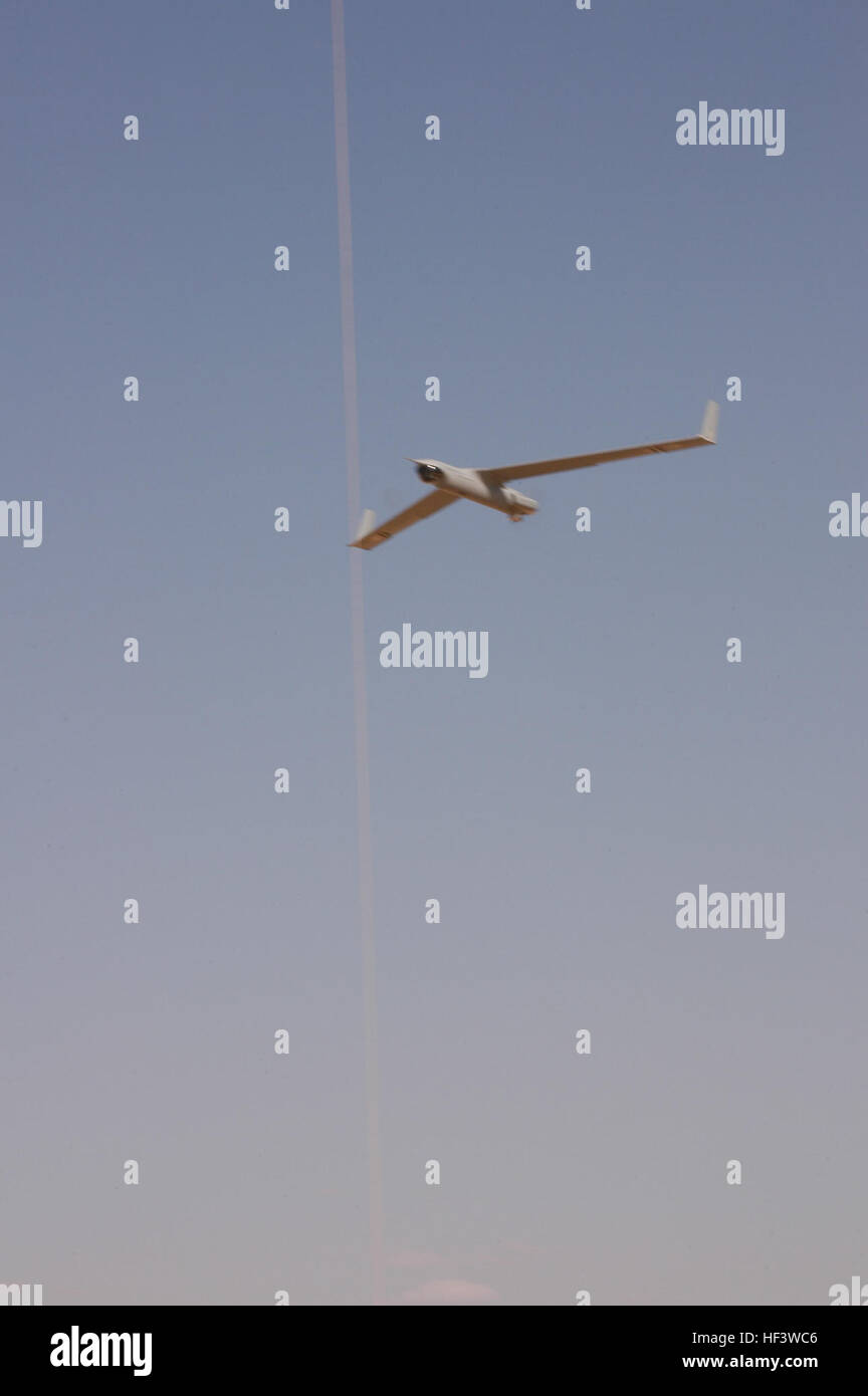 AL ASAD, Iraq--A ScanEagle UAV catches a small rope using what is ...