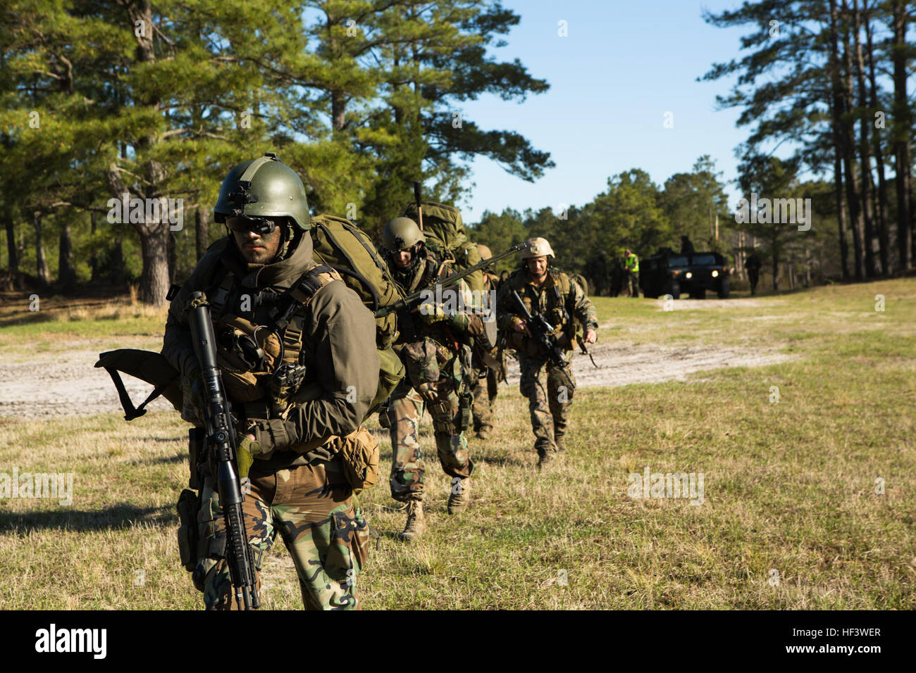 Royal Netherlands Marines maneuver to board a U.S. Marine Corps MV-22 ...
