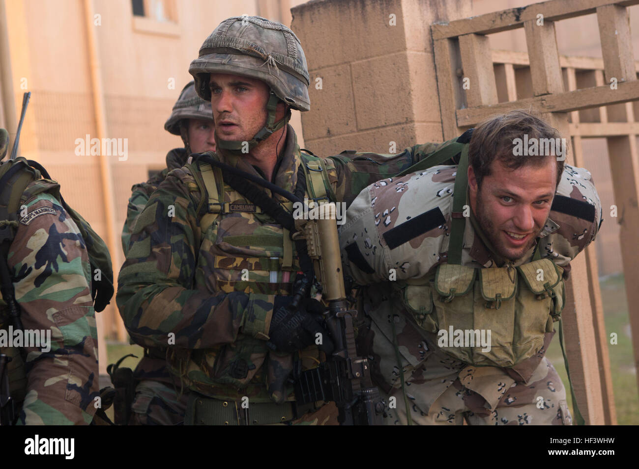 Royal Netherlands Marines move a role-playing captured insurgent during ...
