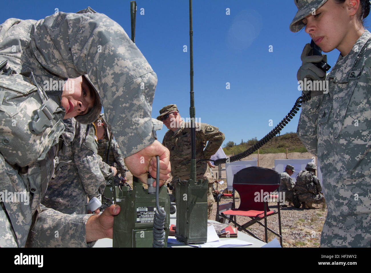 Arizona Guardsman Spc. Anthony Chagolla connects the hand receiver to a ...