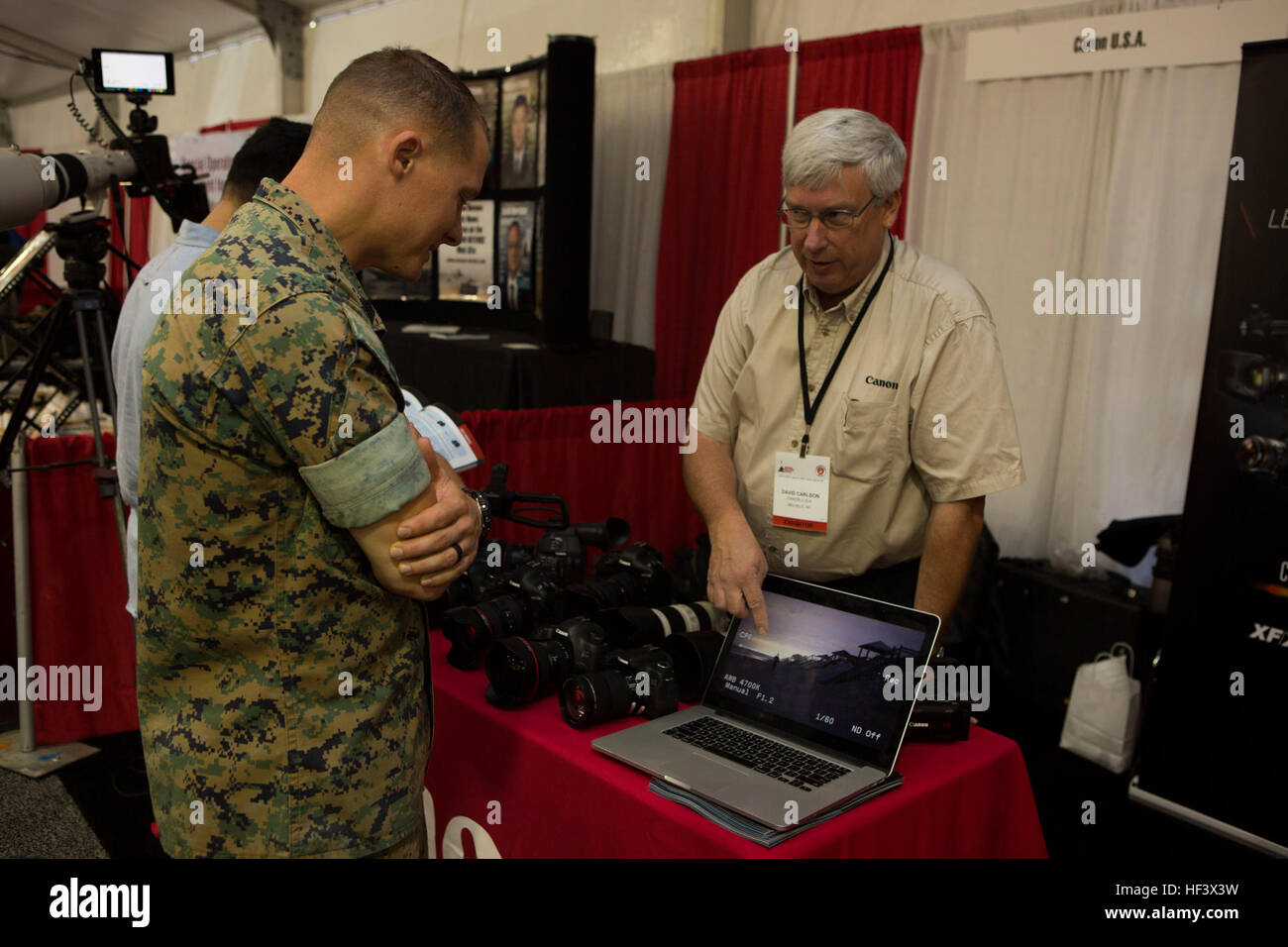 U.S. Marine Corps Gunnery Sgt. Neil Sevelius, left, combat camera chief ...