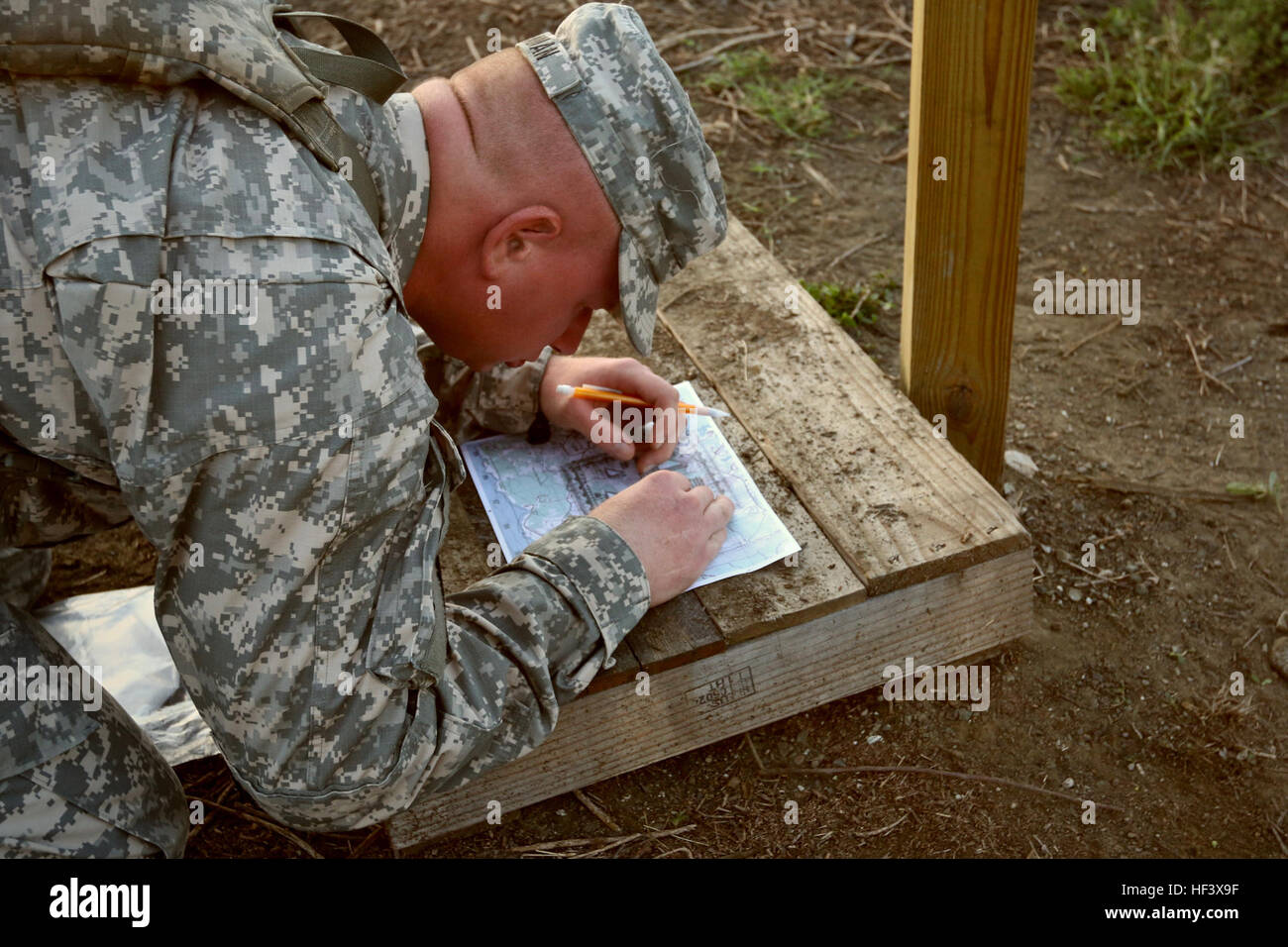 A student from GTMO’s first Army Basic Leadership Course plots his grid ...