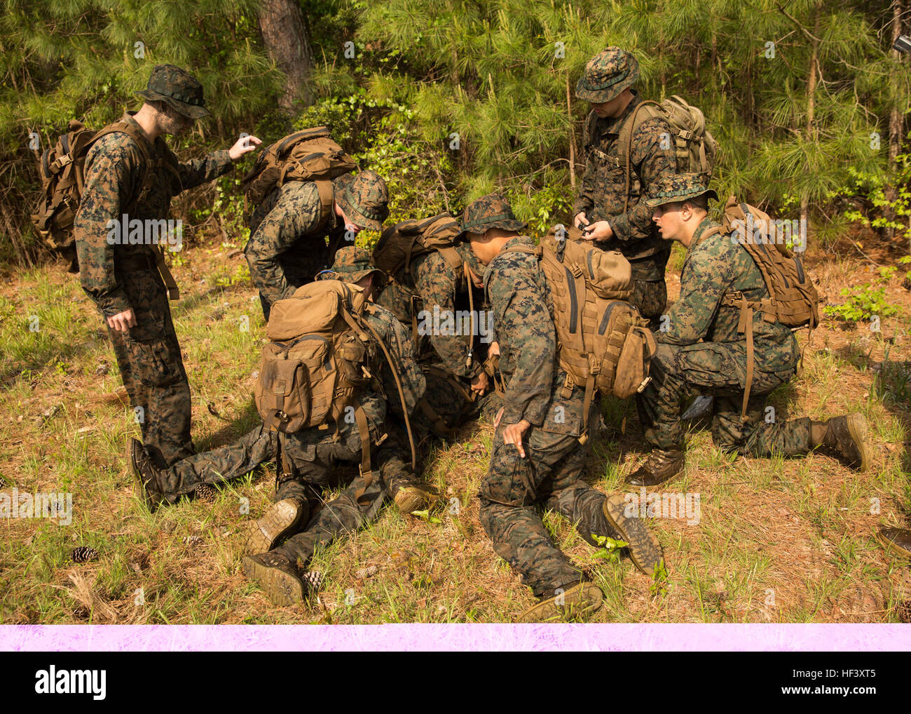A Marine with 2nd Battalion, 8th Marine Regiment applies a tourniquet to a notional casualty ...
