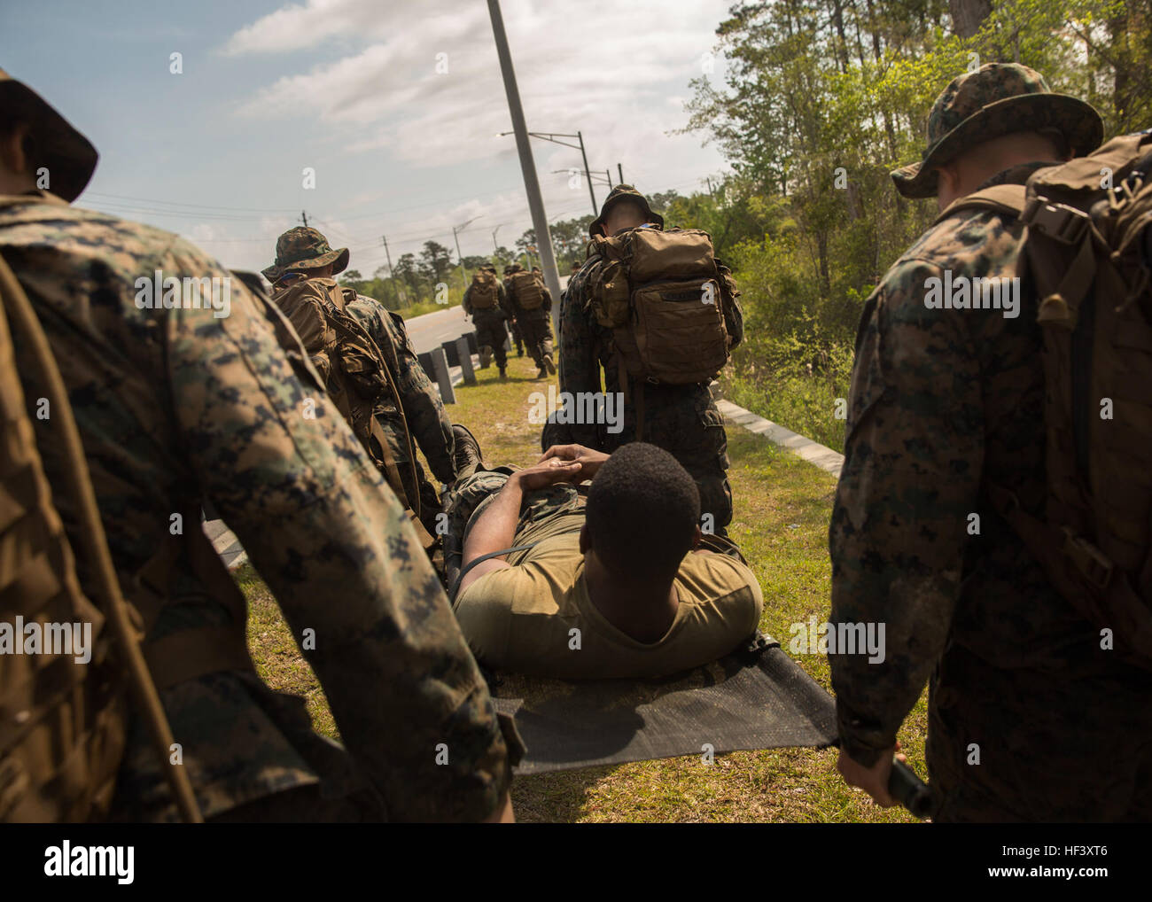U.S. Marines with 2nd Battalion, 8th Marine Regiment transport a casualty to the landing zone ...